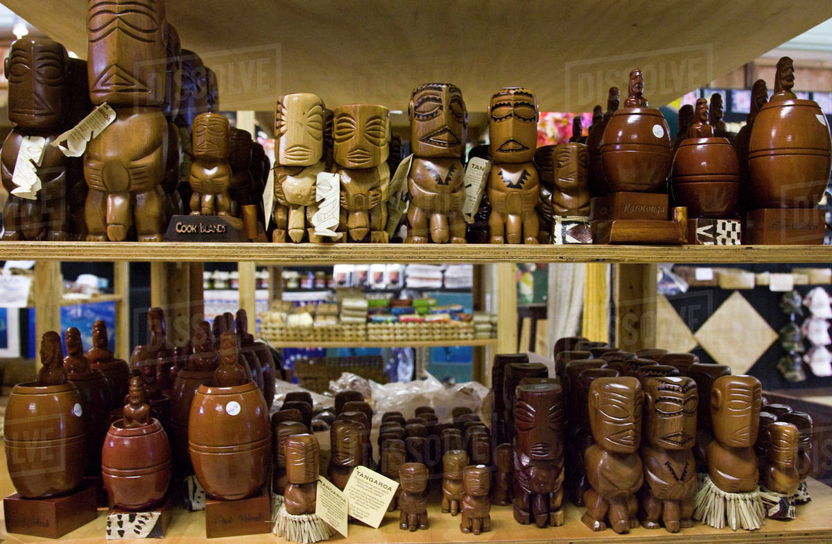 Polynesia, Cook Islands, Rarotonga. Souvenir tikis on display in shop ...