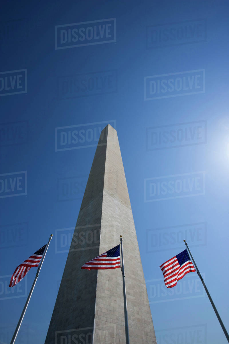 USA, Washington, D.C. American flags at the Washington Monument ...