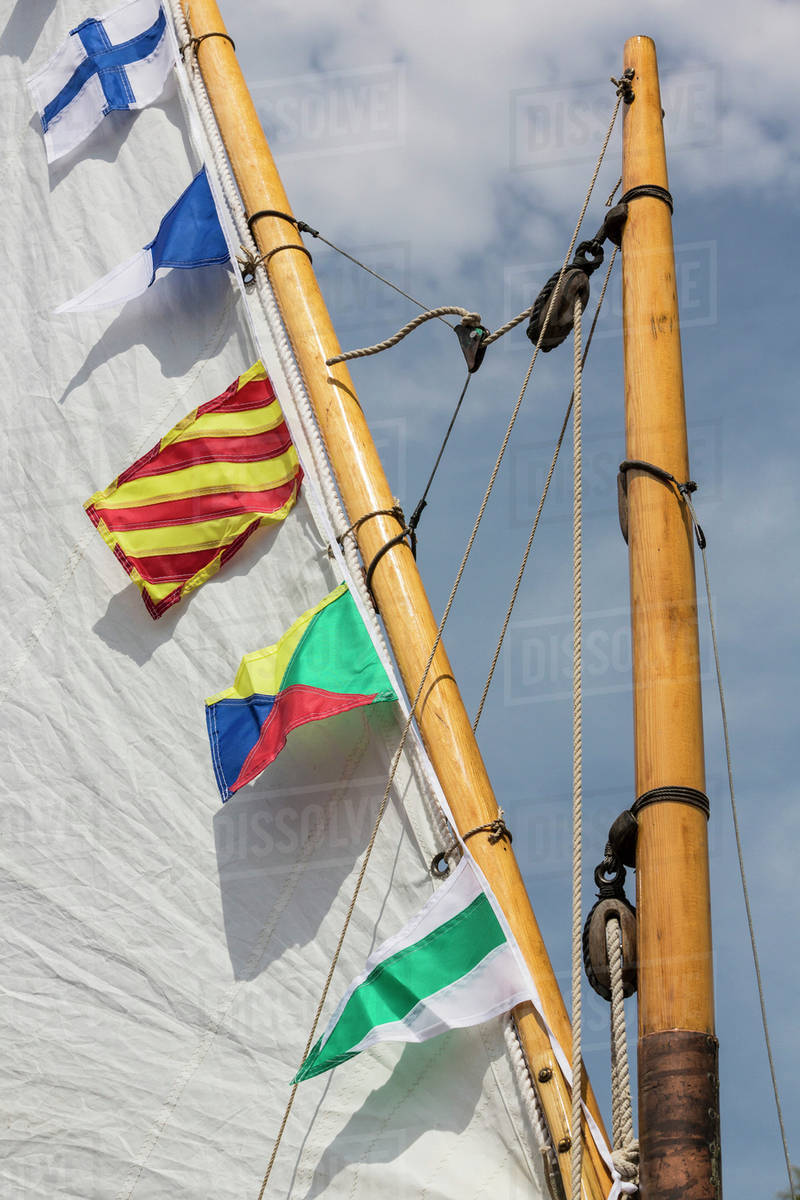 USA, Washington. Boat sail and flags at Bainbridge Island Wooden Boat ...