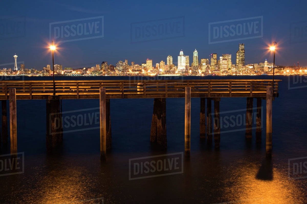 WA, Seattle, Seattle skyline at night & fishing pier, view from ...