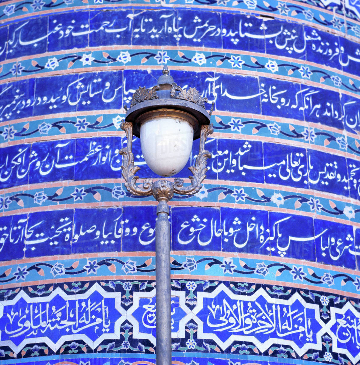 Afghanistan, Herat. An ornate street lamp stands out against the blue ...