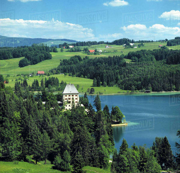 Europe, Austria, Fuschl am See. Schloss Fuschl Castle from the blue of ...