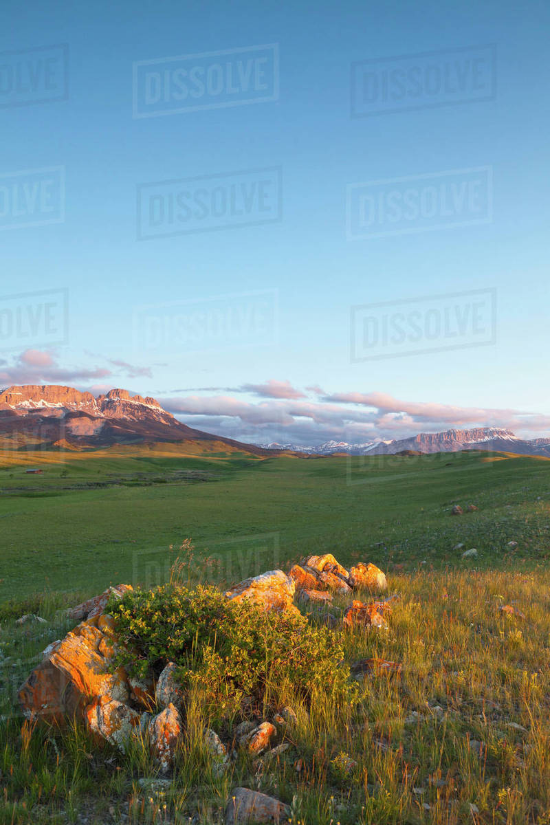Colorful glacier moraine with Sawtooth Ridge and Castle Reef at first ...