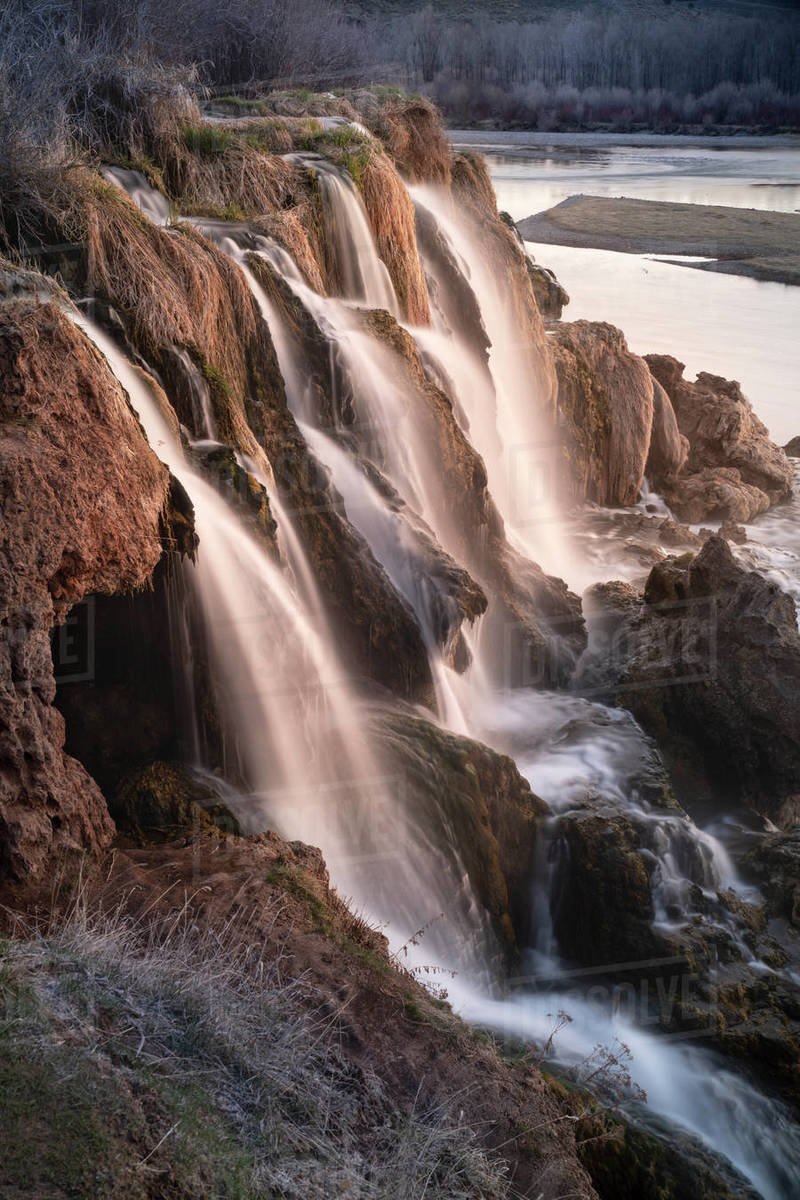 USA, Idaho. Fall Creek Falls flow into Snake River at sunrise ...