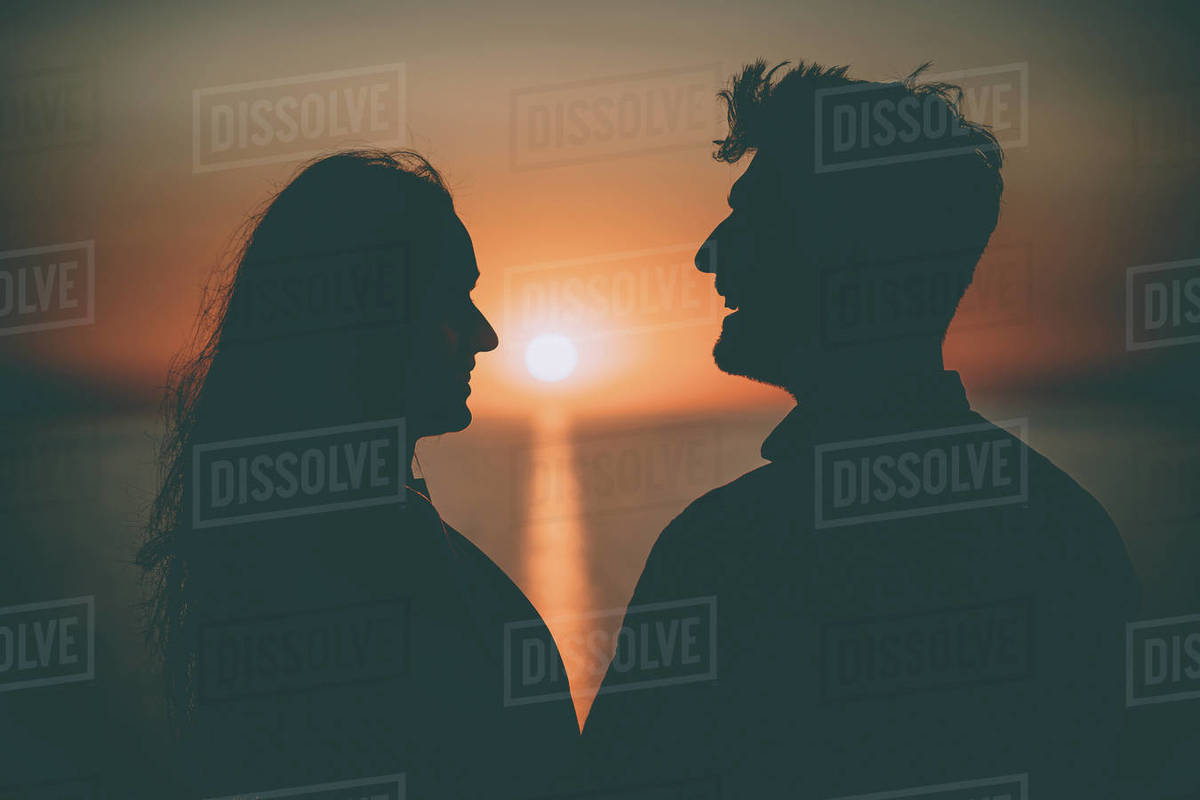 The two people standing on the sunset background - Royalty-free Stock ...