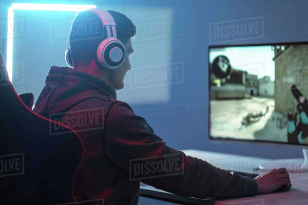 The gamer playing video game on his personal computer - Stock Photo ...