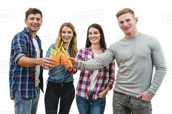 The four happy people clink glasses on a white background - Stock Photo ...