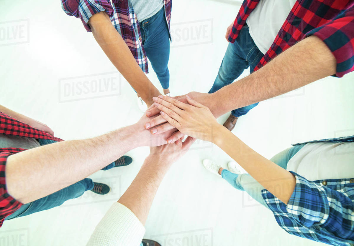 The four people holding hands together - Royalty-free Stock Photo ...