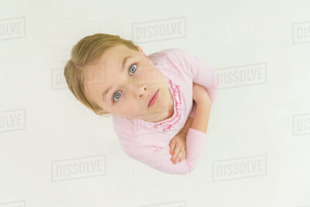 The serious girl look to the camera. View from above - Royalty-free ...