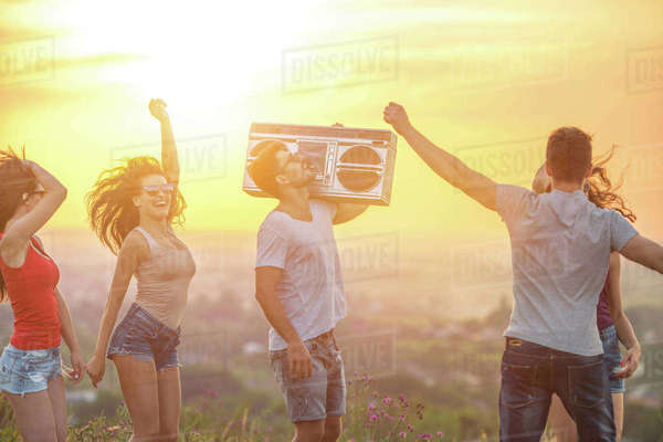 The five people dancing with a boom box on the sunny background - Stock ...