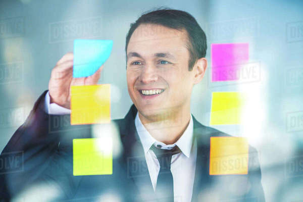 The businessman work with stickers on the glass - Royalty-free Stock ...