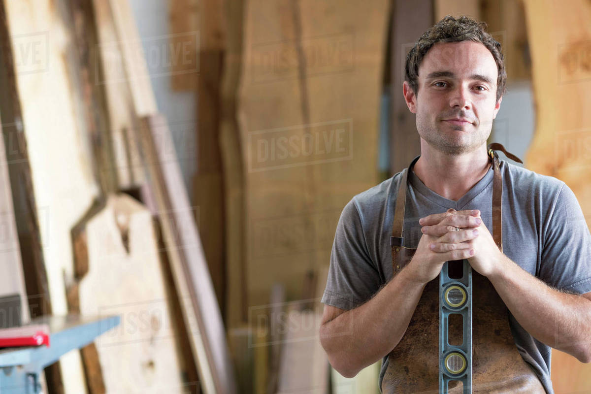 Carpenter at his workshop, holding woodwork tool - Royalty-free Stock ...