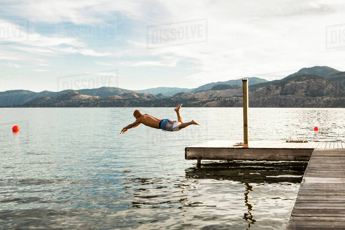 Man diving into lake, Penticton, Canada - Royalty-free Stock Photo ...