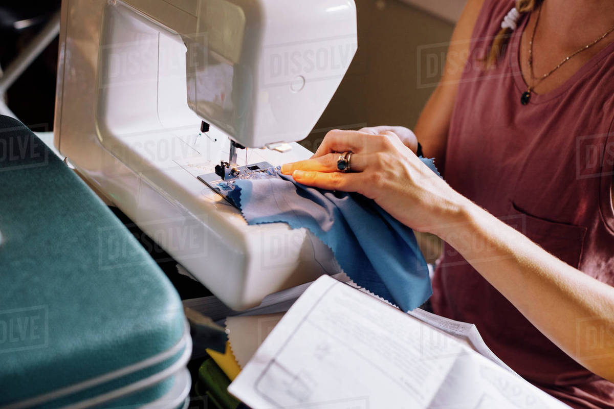 Hands of woman sewing on sewing machine - Royalty-free Stock Photo ...
