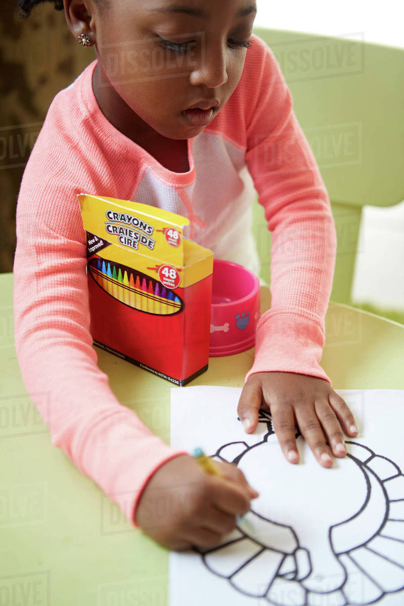 Young girl enjoying colouring in activity - Royalty-free Stock Photo ...