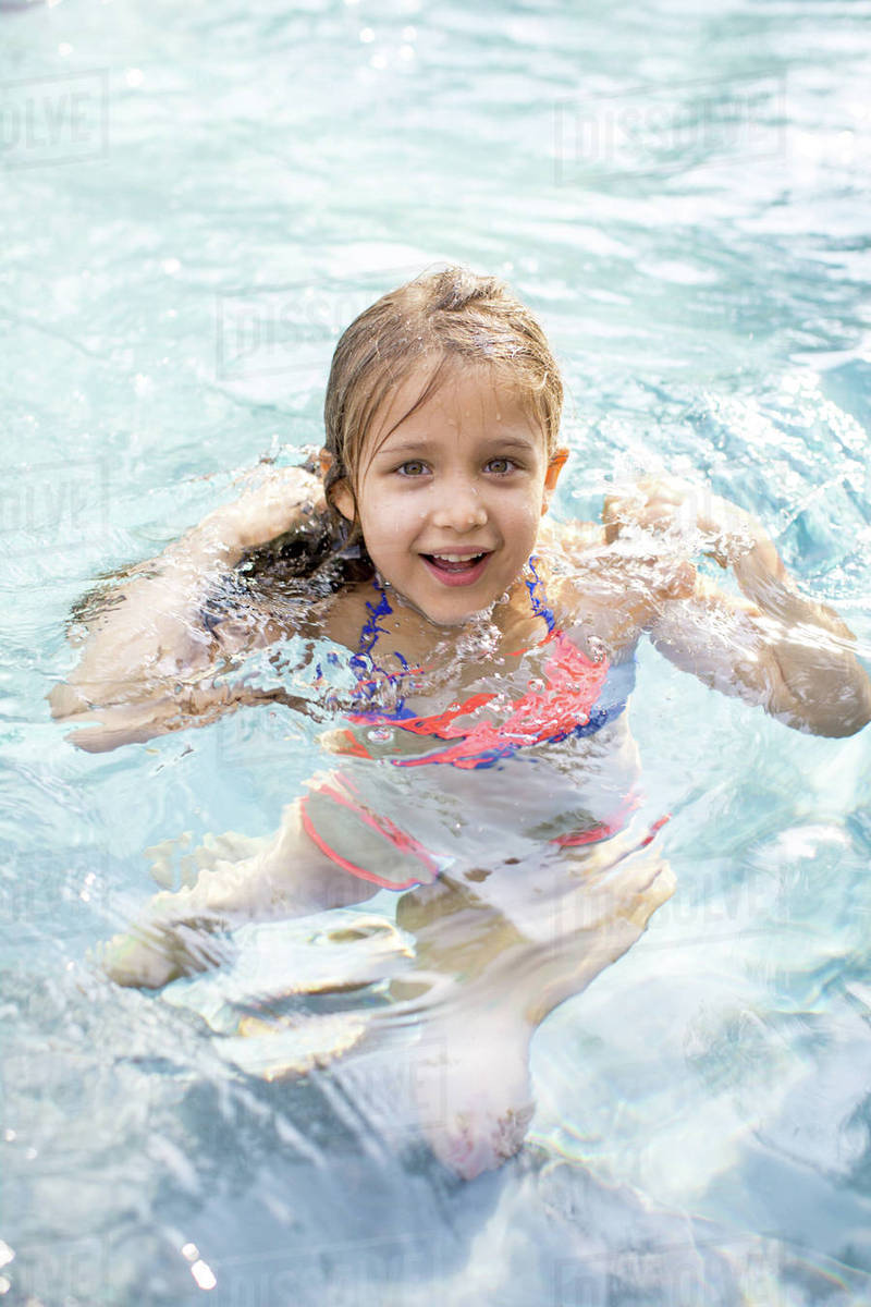 Portrait of girl treading water in outdoor swimming pool - Stock Photo ...