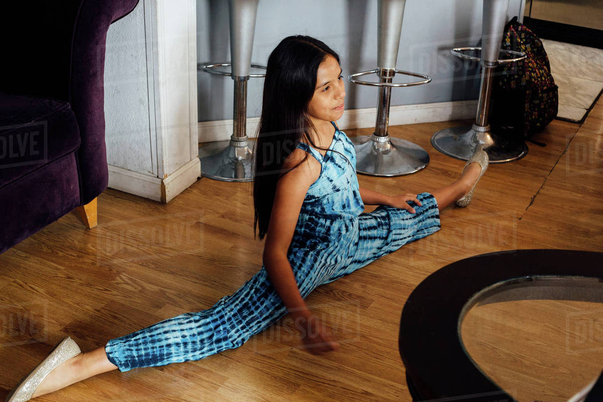 Girl doing splits - Stock Photo - Dissolve