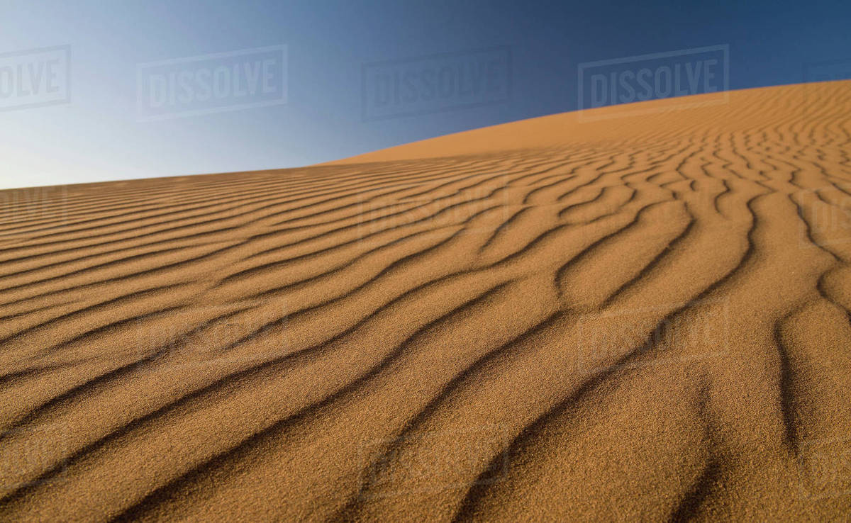 Ripples on sand dunes in desert - Stock Photo - Dissolve