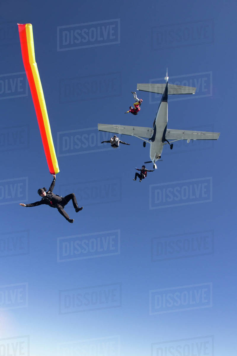 People skydiving from plane - Royalty-free Stock Photo | Dissolve