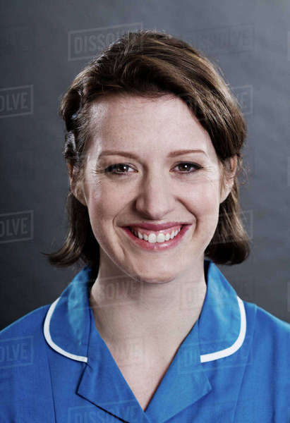 Close up of nurses smiling face - Royalty-free Stock Photo | Dissolve