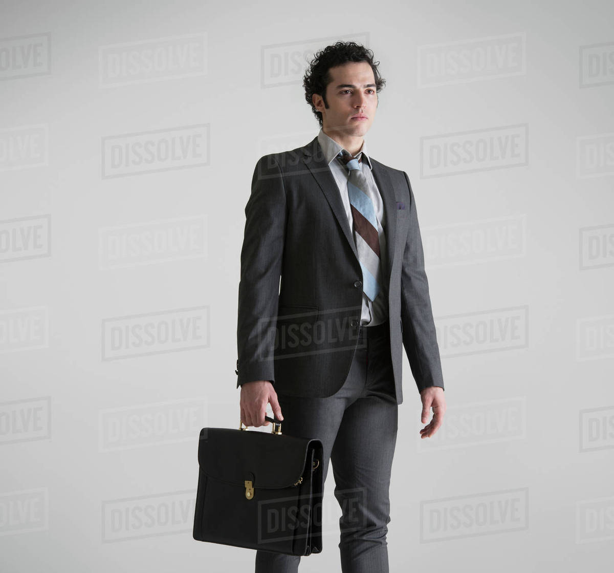 Man holding suitcase - Royalty-free Stock Photo | Dissolve