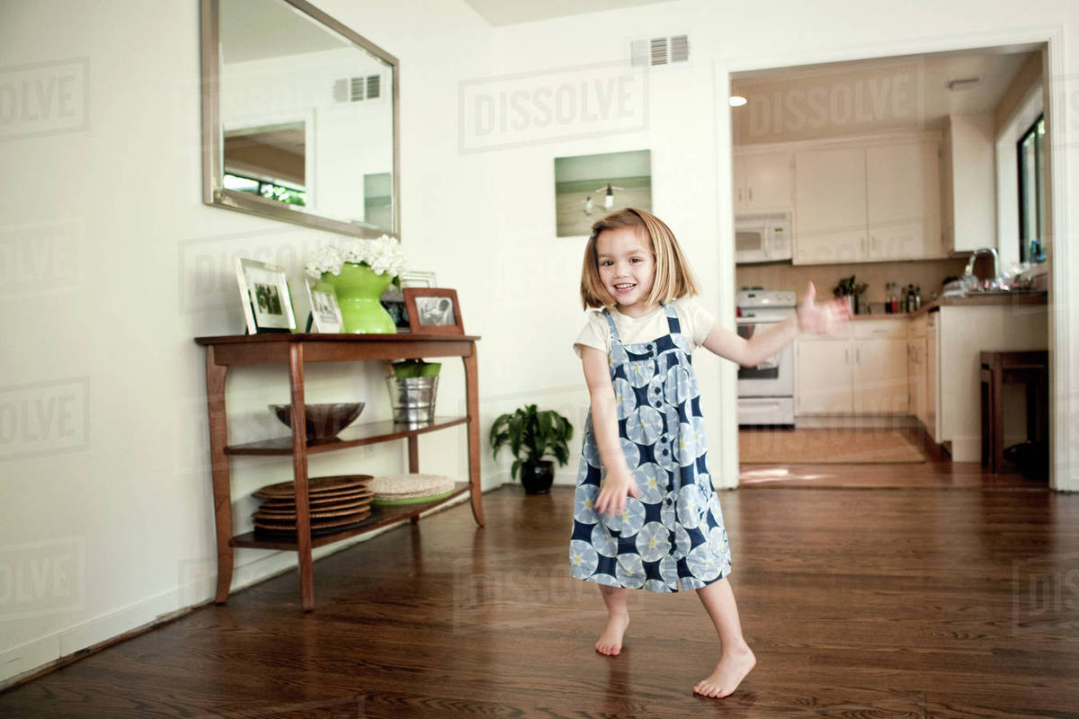Little girl dancing at home - Royalty-free Stock Photo | Dissolve