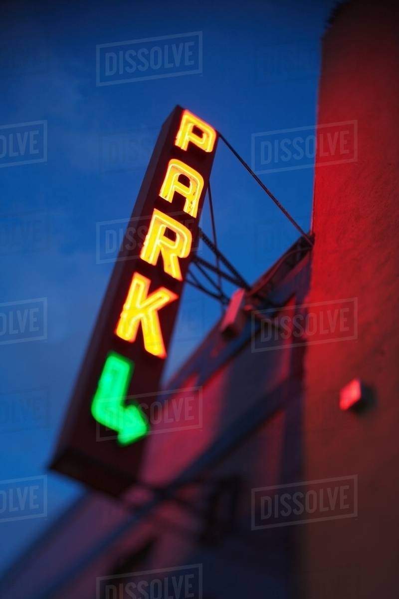 Illuminated neon parking sign on building - Royalty-free Stock Photo ...