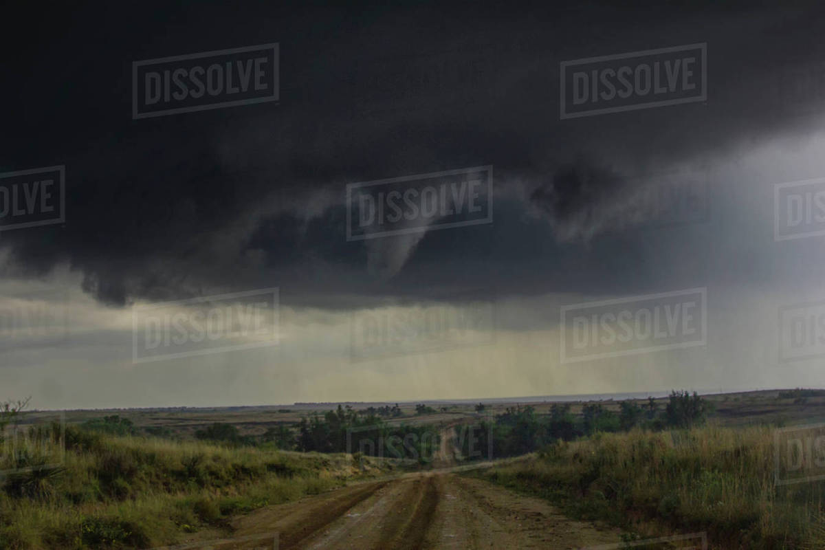 Rotating funnel cloud over rural road, McLean, Texas, United States ...