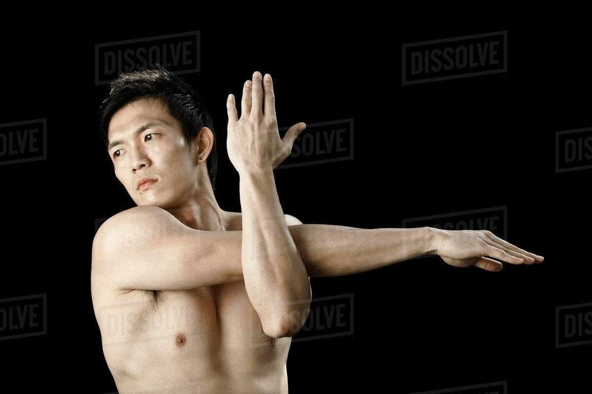 Swimmer stretching arm - Stock Photo - Dissolve