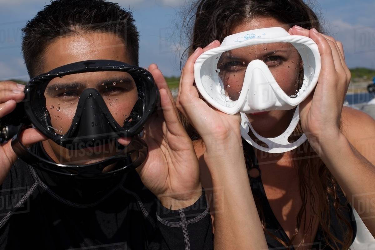 Playful Couple with Face Masks - Royalty-free Stock Photo | Dissolve