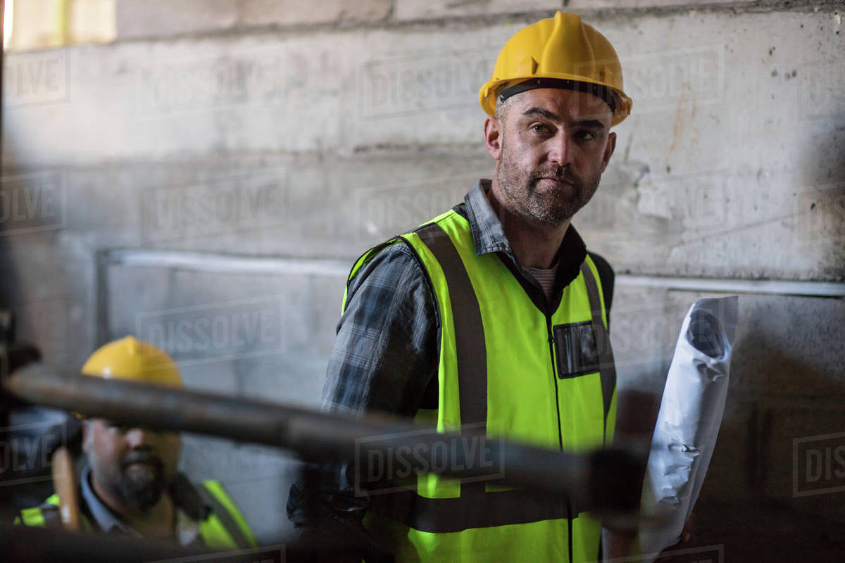 Construction workers on building site - Stock Photo - Dissolve