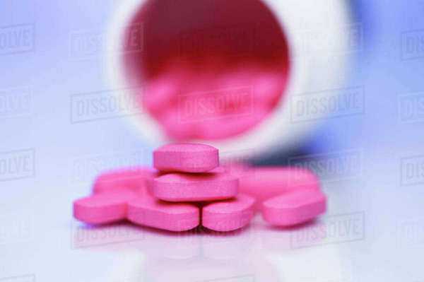 Pink 25mg Diphenhydramine antihistamine pills from medicine bottle ...