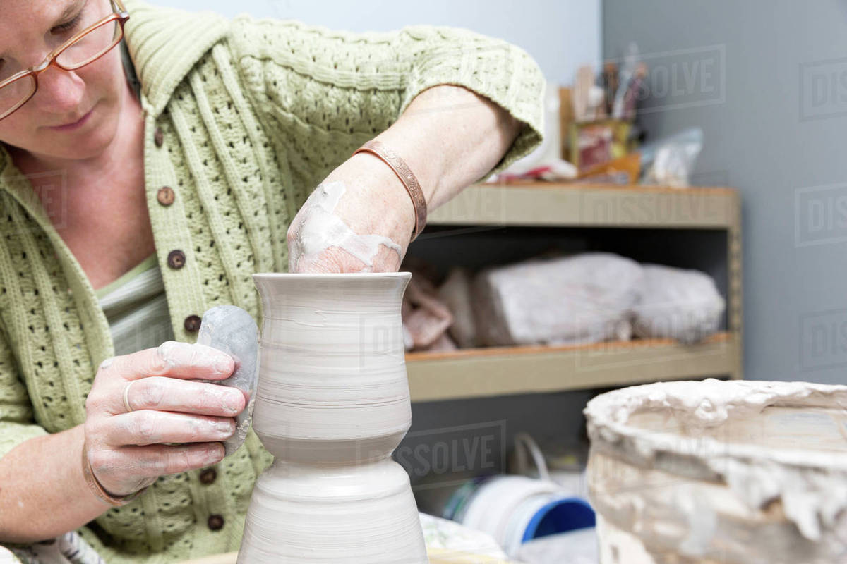 Potter working in studio - Stock Photo - Dissolve
