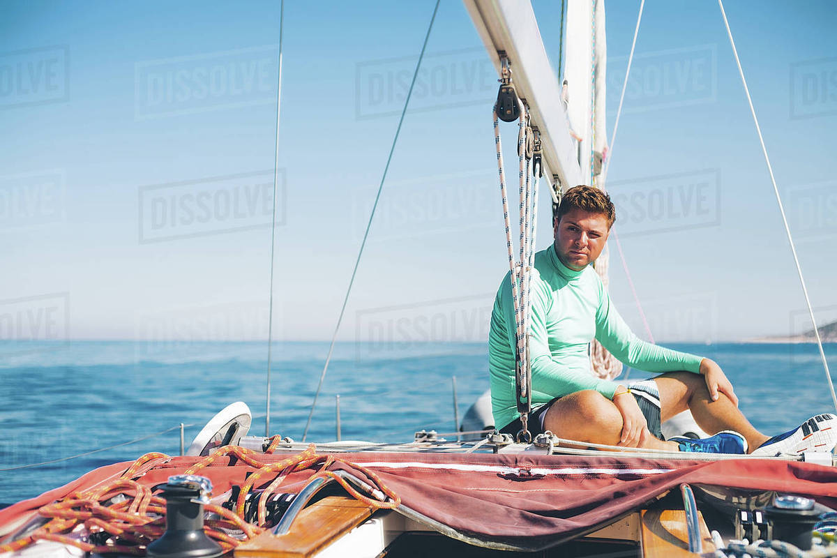 Man on sail boat - Stock Photo - Dissolve