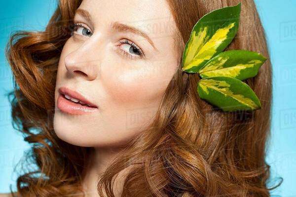 Woman with leaves in hair - Stock Photo - Dissolve