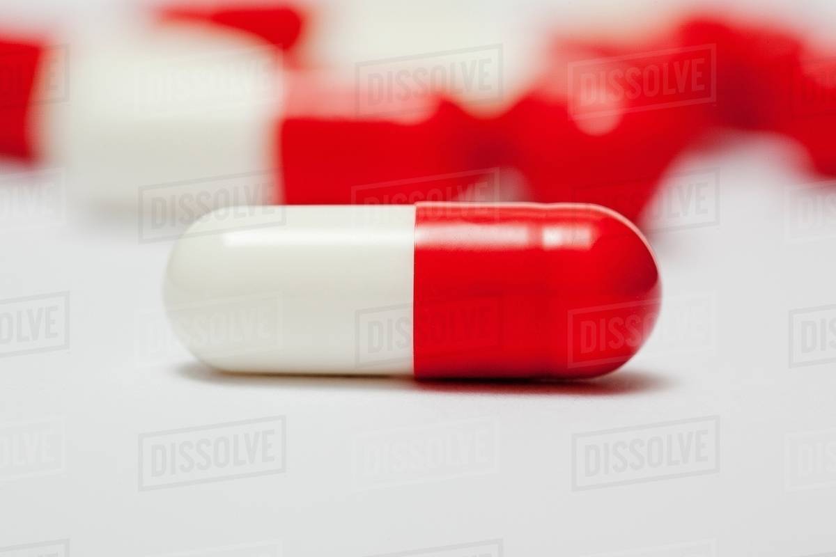 Red and white capsules - Royalty-free Stock Photo | Dissolve