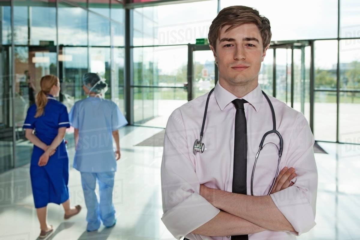 Portrait of doctor in hospital foyer - Stock Photo - Dissolve