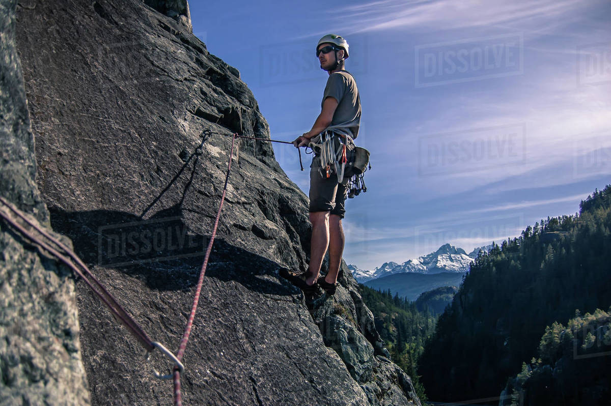 Rock climber climbing on The Chief, Malamute, Squamish, Canada - Stock ...