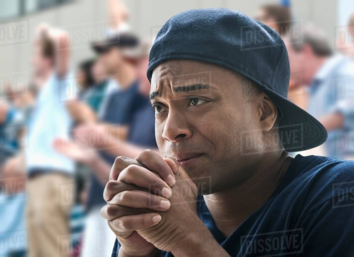 Tense man at sports game - Royalty-free Stock Photo | Dissolve