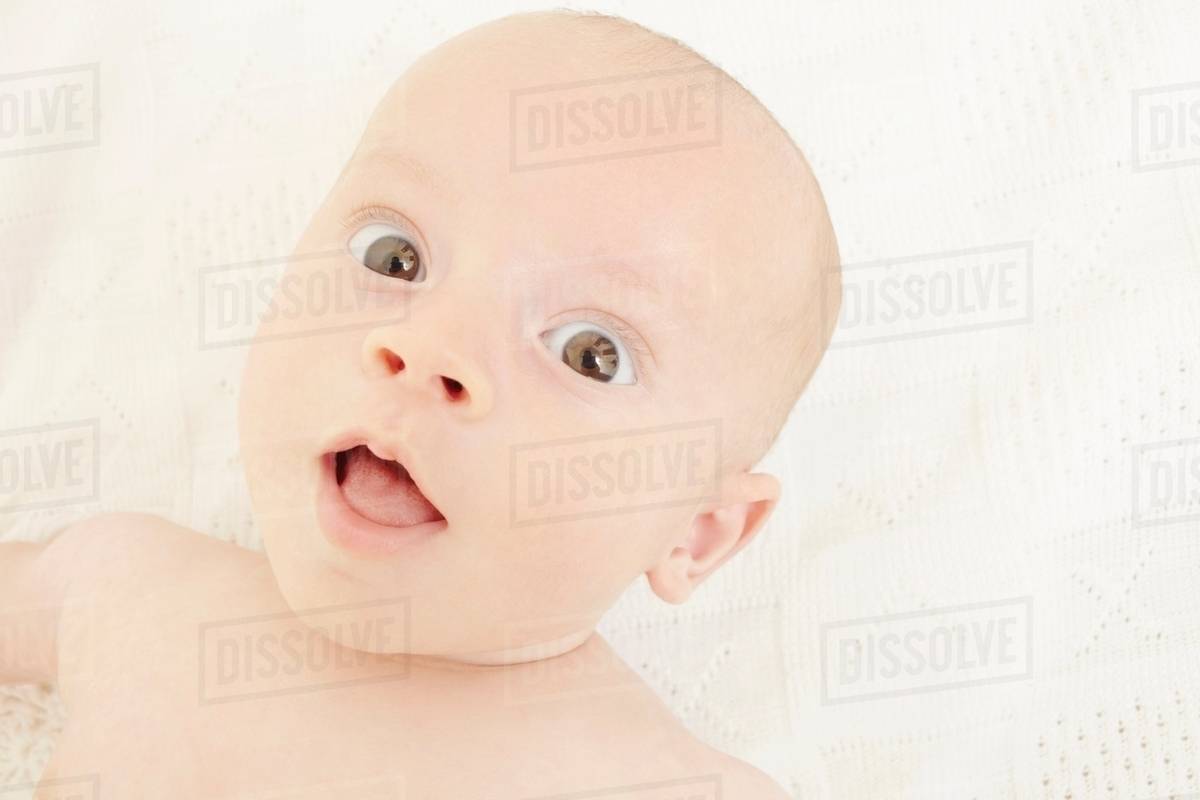 Baby girl staring at camera - Royalty-free Stock Photo | Dissolve