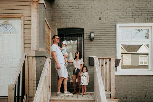 Family at front door of home - Royalty-free Stock Photo | Dissolve