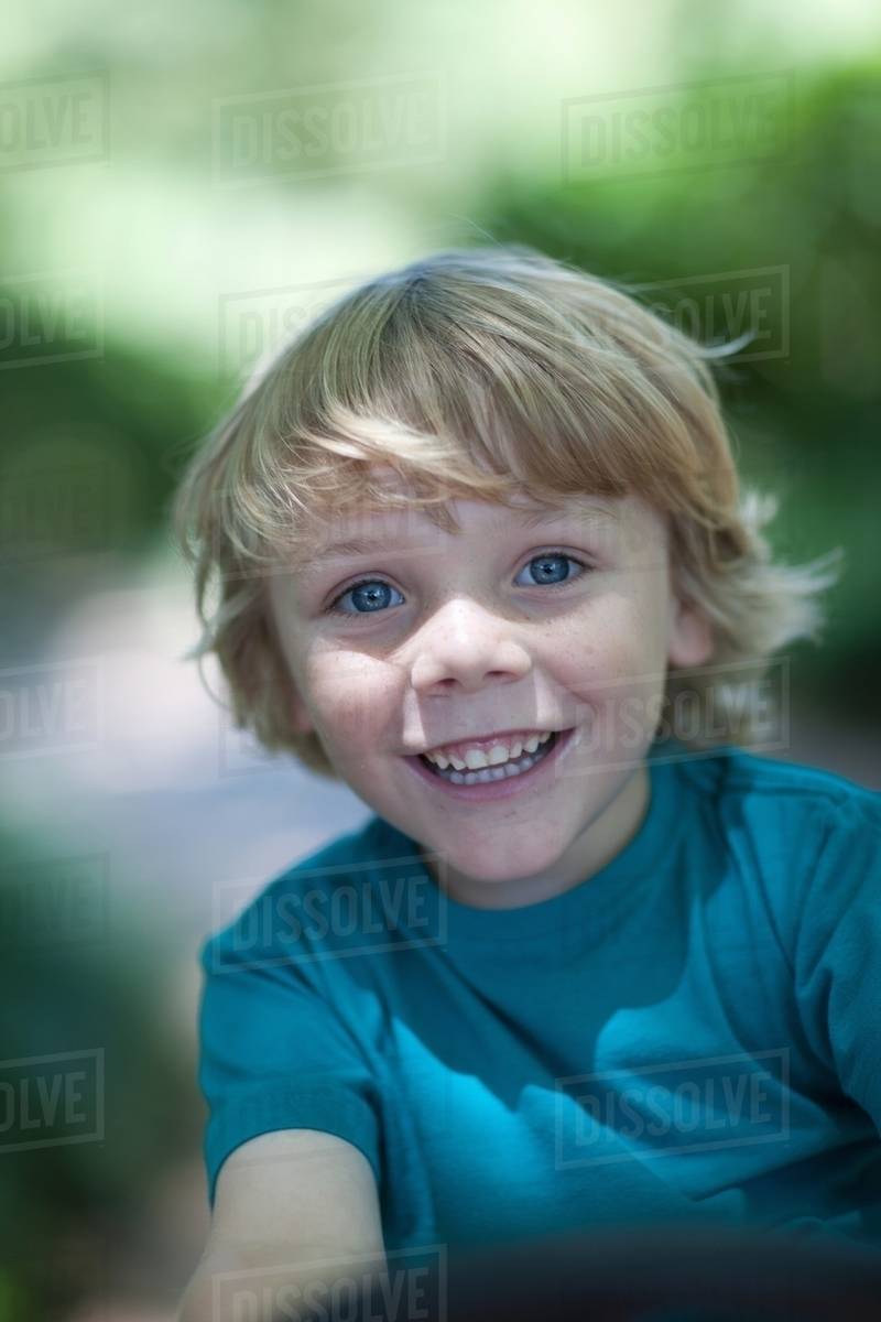 Close up of boy's smiling face - Royalty-free Stock Photo | Dissolve