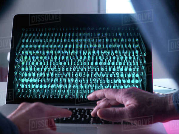 Cyber Crime, laptop computer being hacked - Stock Photo - Dissolve