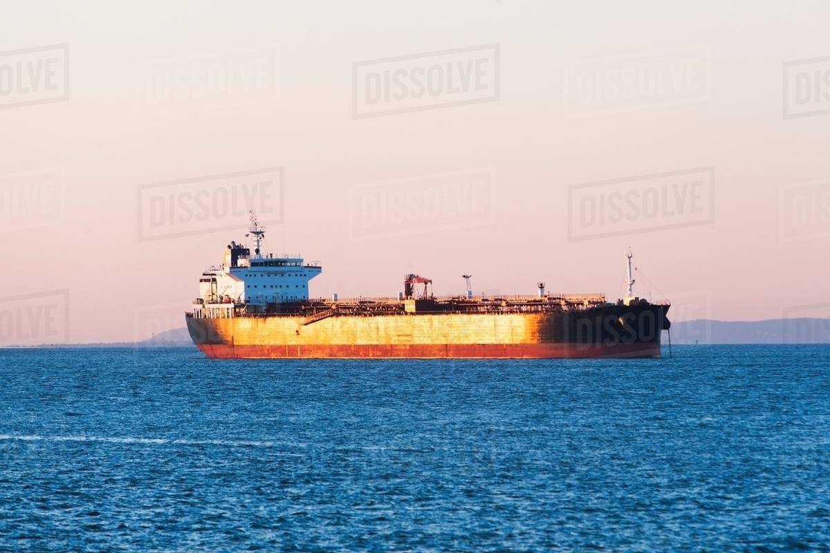 Oil tanker at sunset - Stock Photo - Dissolve