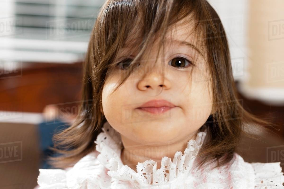 Close up of girl's skeptical face - Royalty-free Stock Photo | Dissolve