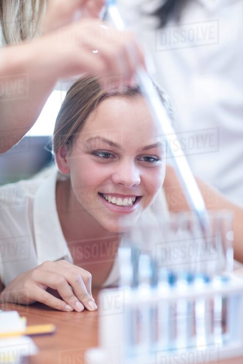 School girls enjoying science lesson - Stock Photo - Dissolve