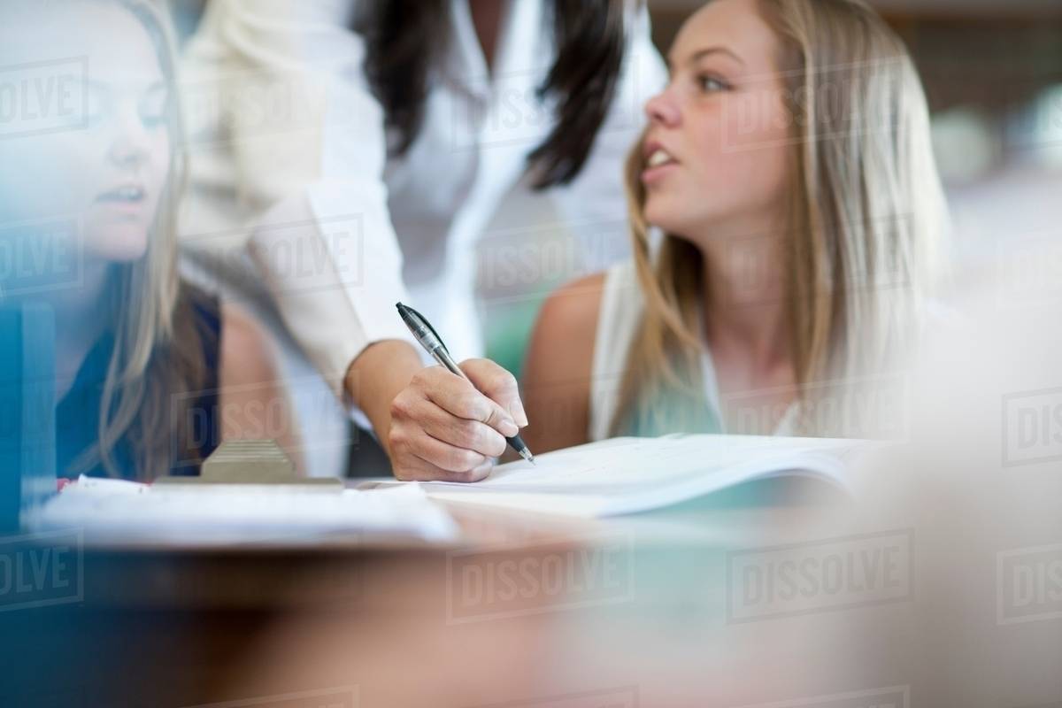 Science teacher in class - Royalty-free Stock Photo | Dissolve