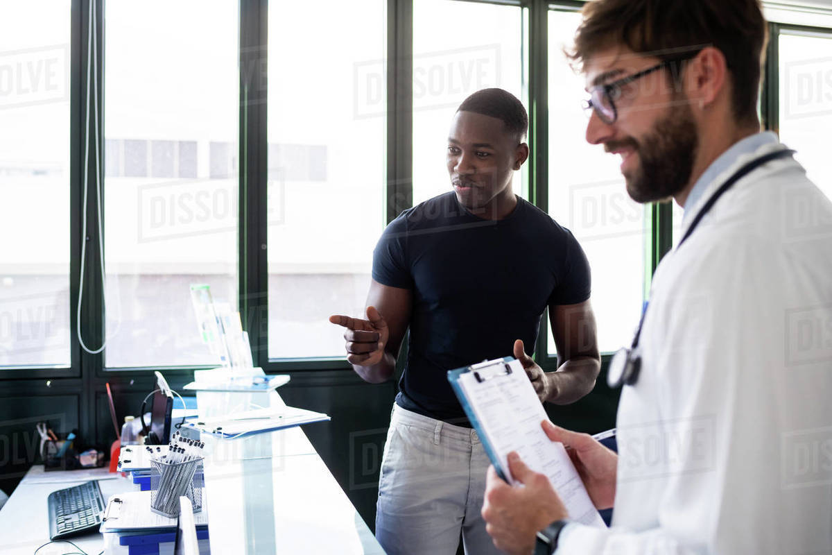 Doctor and patient at hospital reception - Royalty-free Stock Photo ...