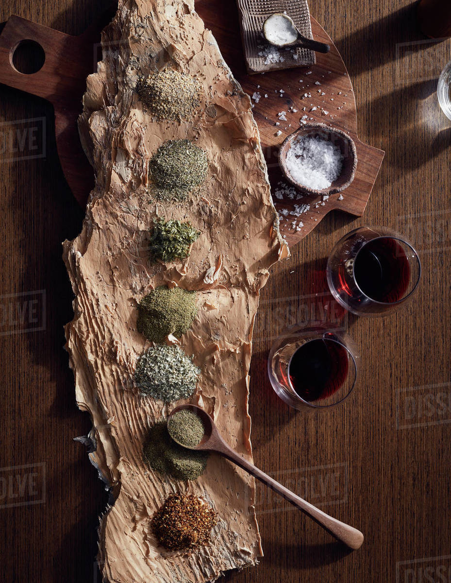 Variety of bush spices on log platter, a bush tucker dish using ...