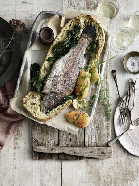 Whole fish baked in bread - Royalty-free Stock Photo | Dissolve